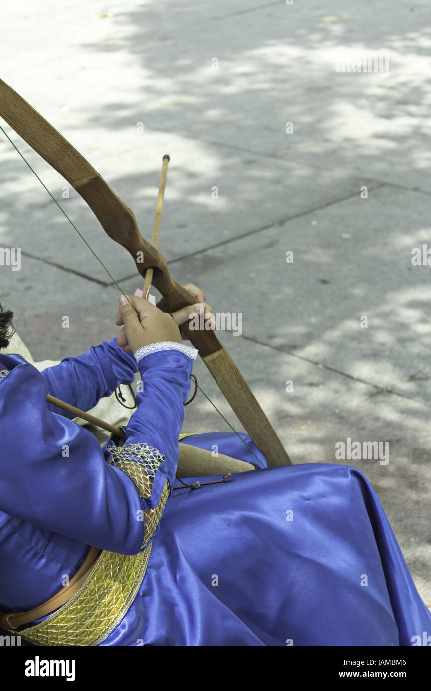 Archer with arrows hanging on the back, uniform, weapons and ...