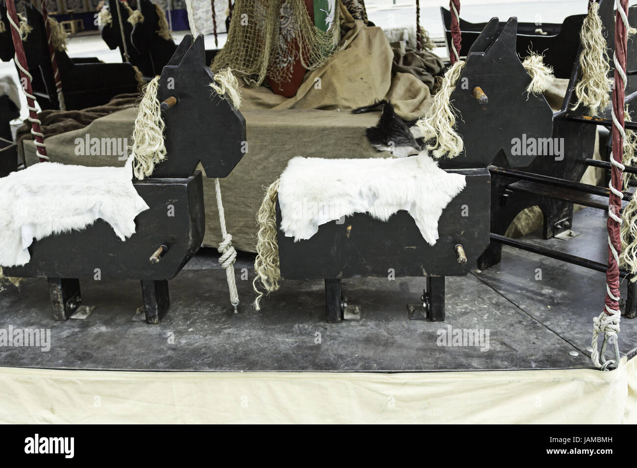 Wooden horse carousel medieval celebration and event Stock Photo - Alamy