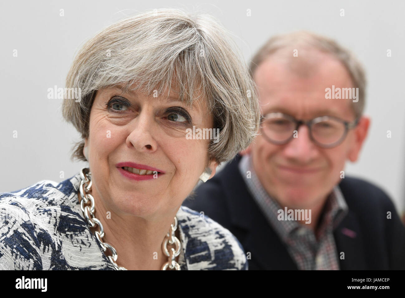 Prime Minister Theresa May and her husband Philip meet staff at a ...