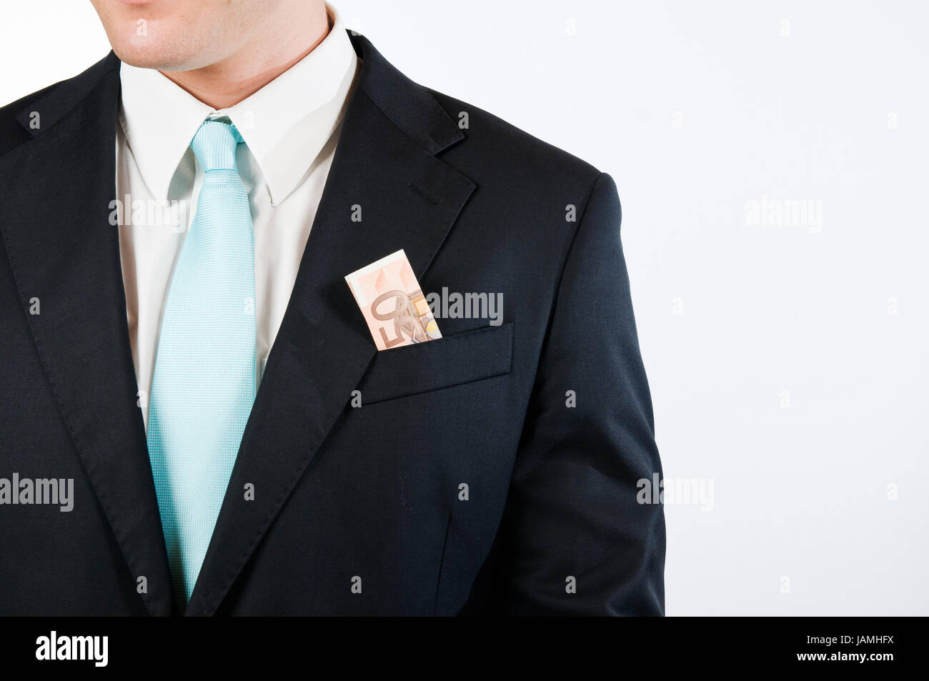 Upper body view without head of a young man in a black suit against ...