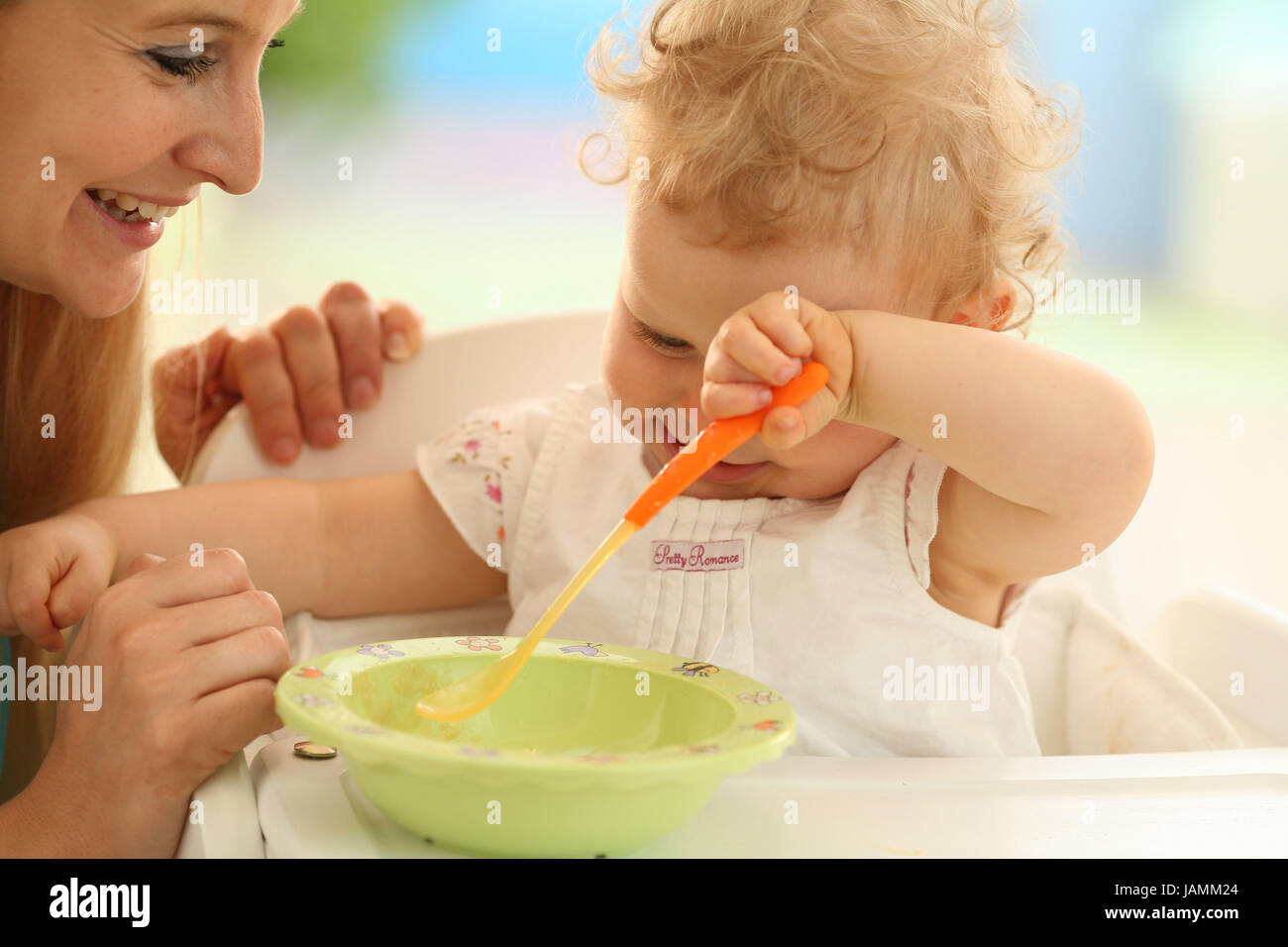 Raised hide,infant,plate,eat,all alone,mother,watch,portrait Stock ...