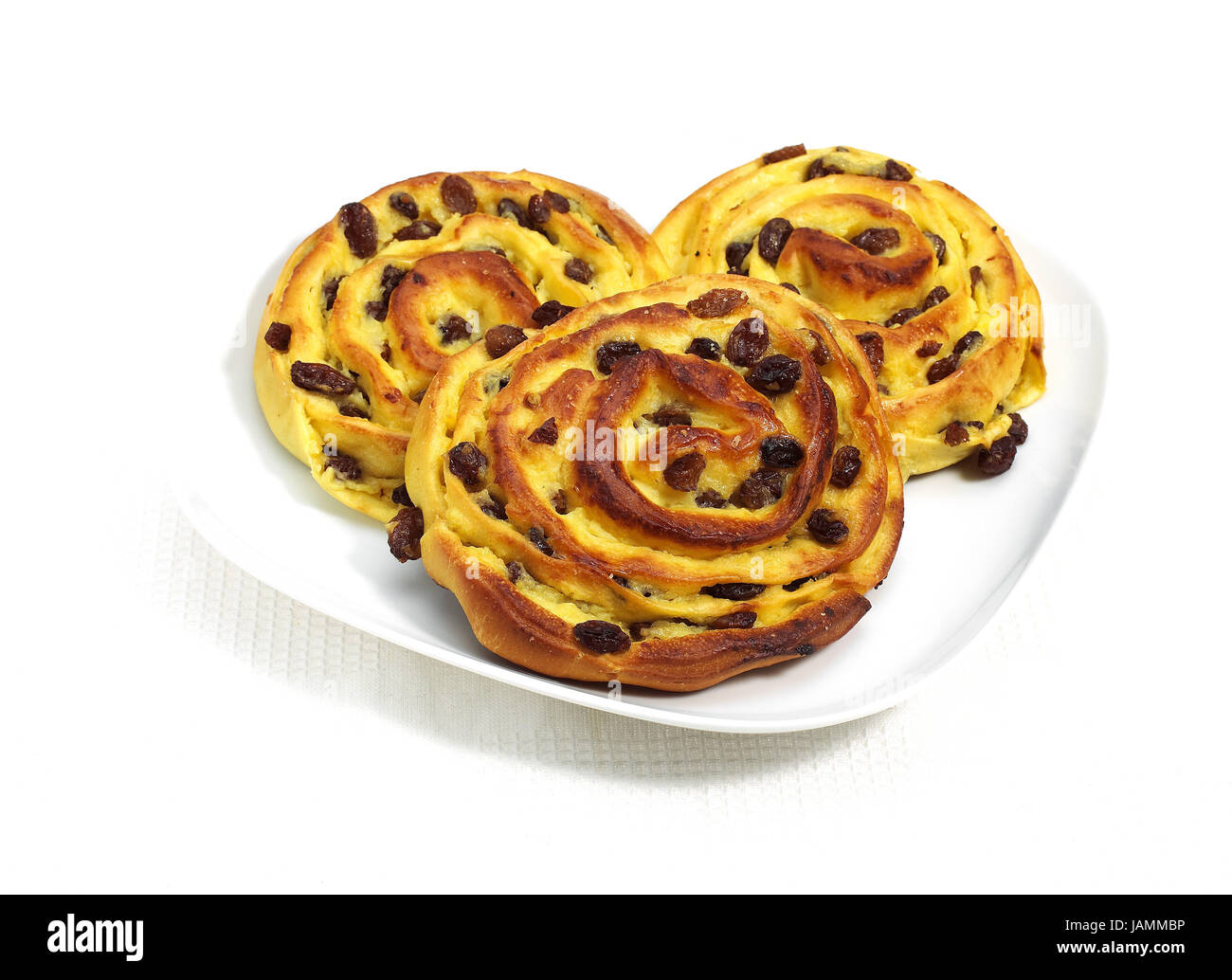 Flaky pastry,raisins,white background Stock Photo - Alamy