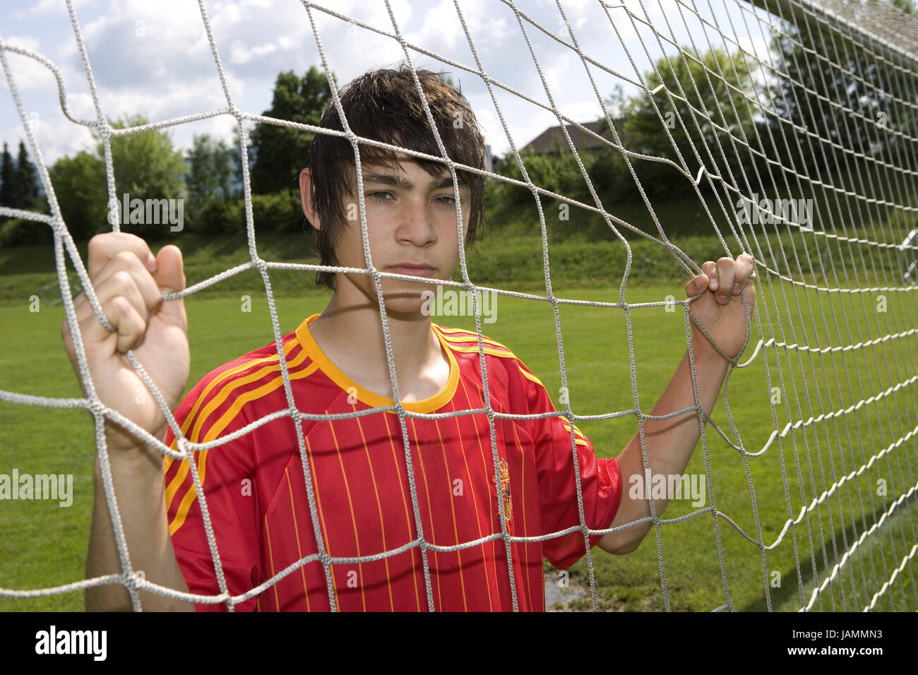 Young person,gate,stand,hold network,portrait Stock Photo - Alamy
