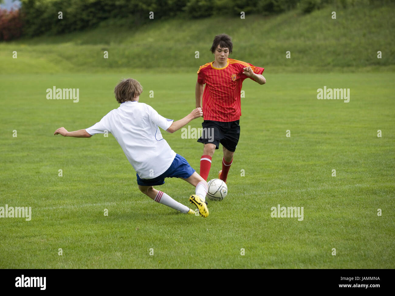 Young person,football match,tackle,defence Stock Photo - Alamy