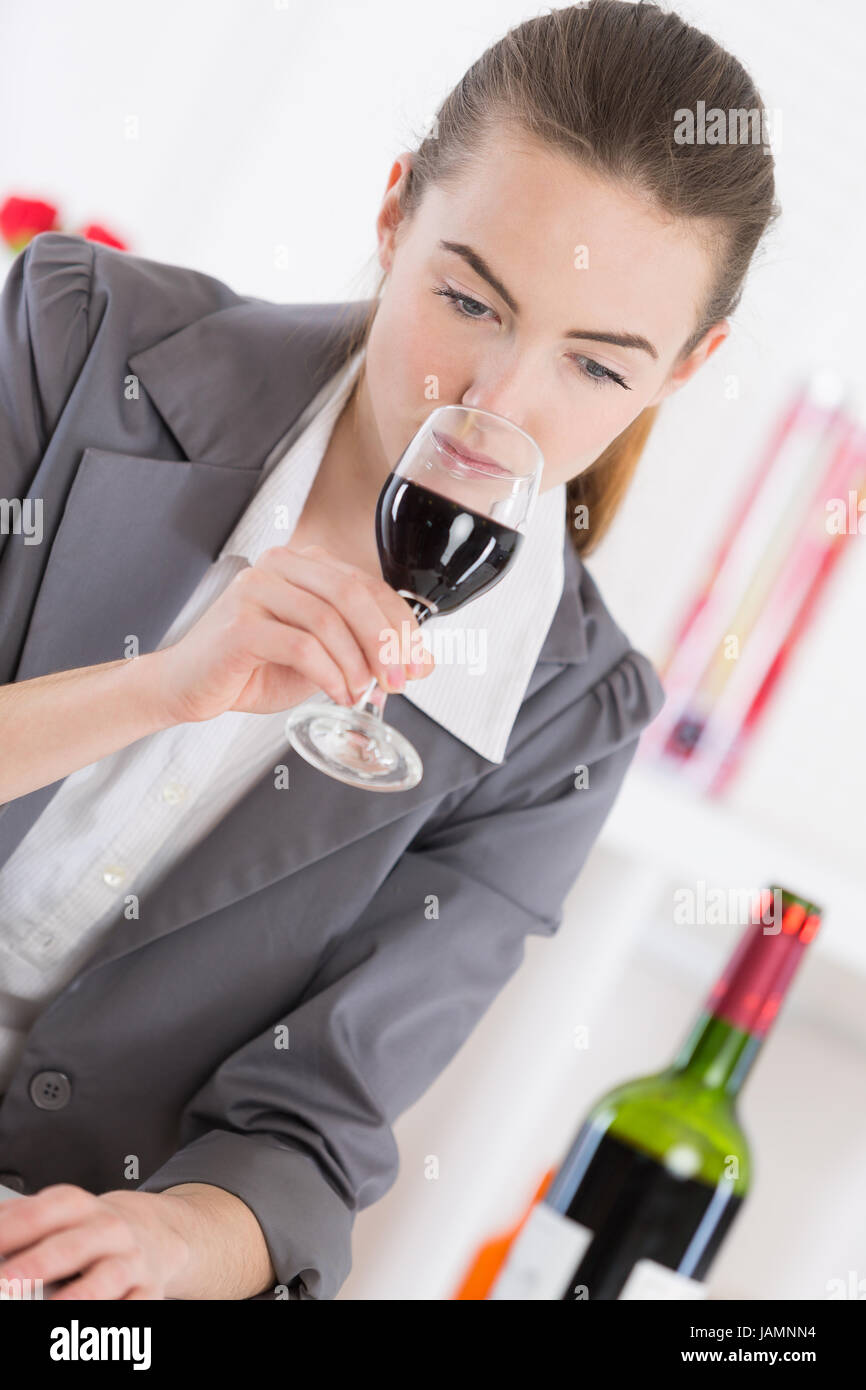 woman sniffing red wine in a glass close up Stock Photo - Alamy