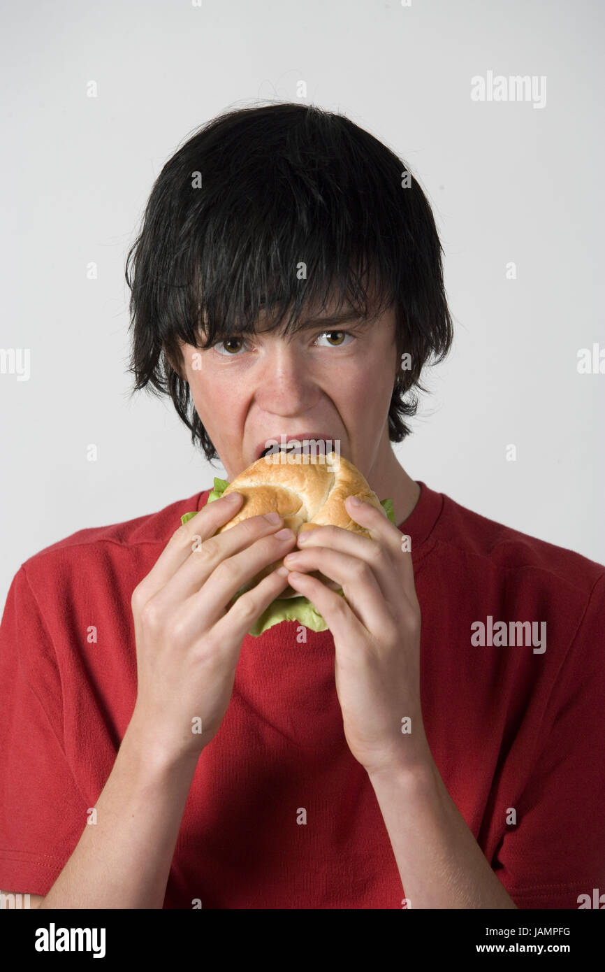 Teenagers,boy,bread roll,eat,bite off,portrait Stock Photo - Alamy