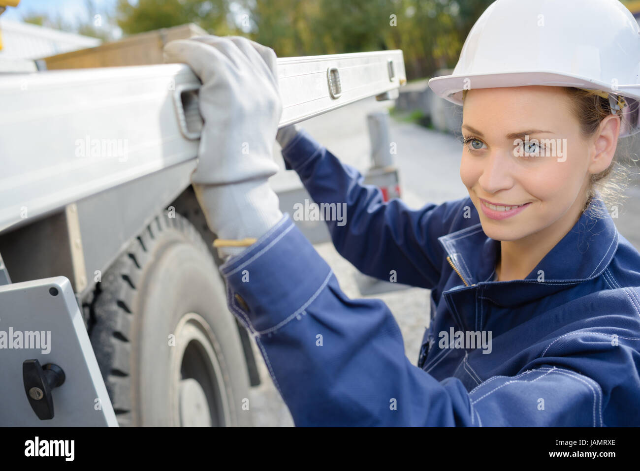 beautiful female engineer near a big truck Stock Photo - Alamy