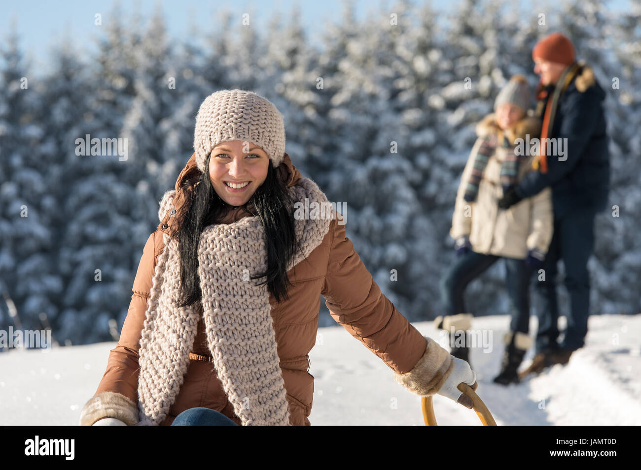 Winter young people friends enjoy snow on wooden sledge sunny Stock ...