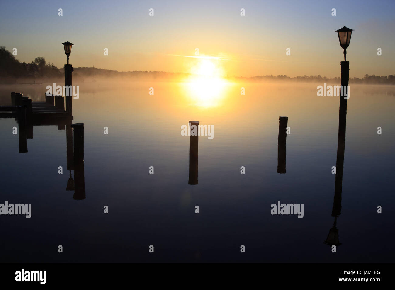 Germany,Bavaria,Upper Bavaria,Chiemgau,Lake Chiem,sunrise,back light ...