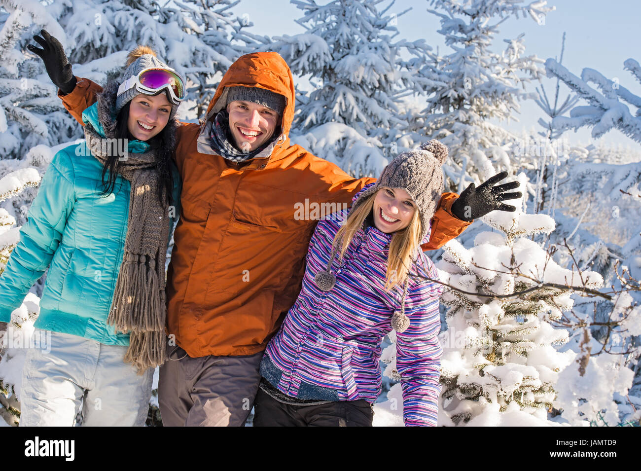 Friends enjoy winter holiday break snow mountains sunny sport Stock ...