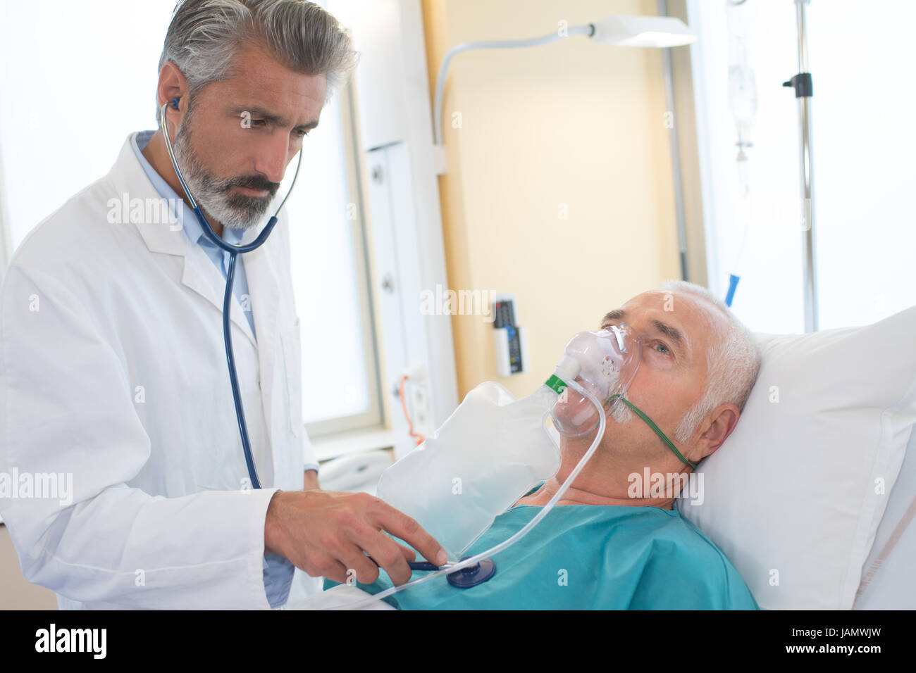 senior patient making inhalation with nebuliser in exam room Stock ...
