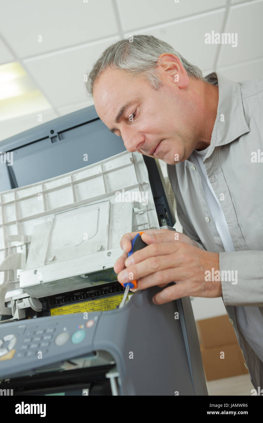 the office handyman Stock Photo - Alamy
