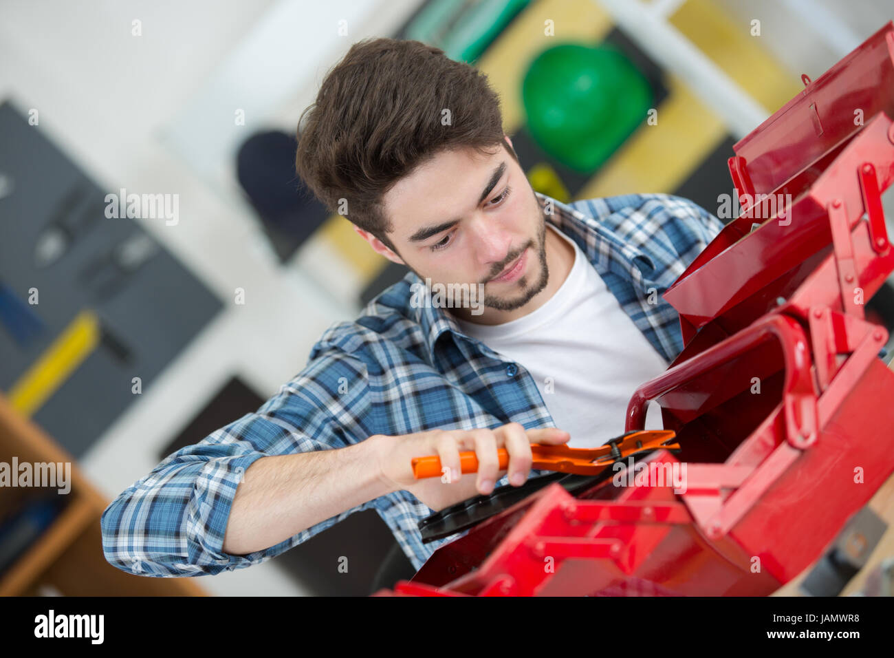 worker and his red tool box Stock Photo - Alamy