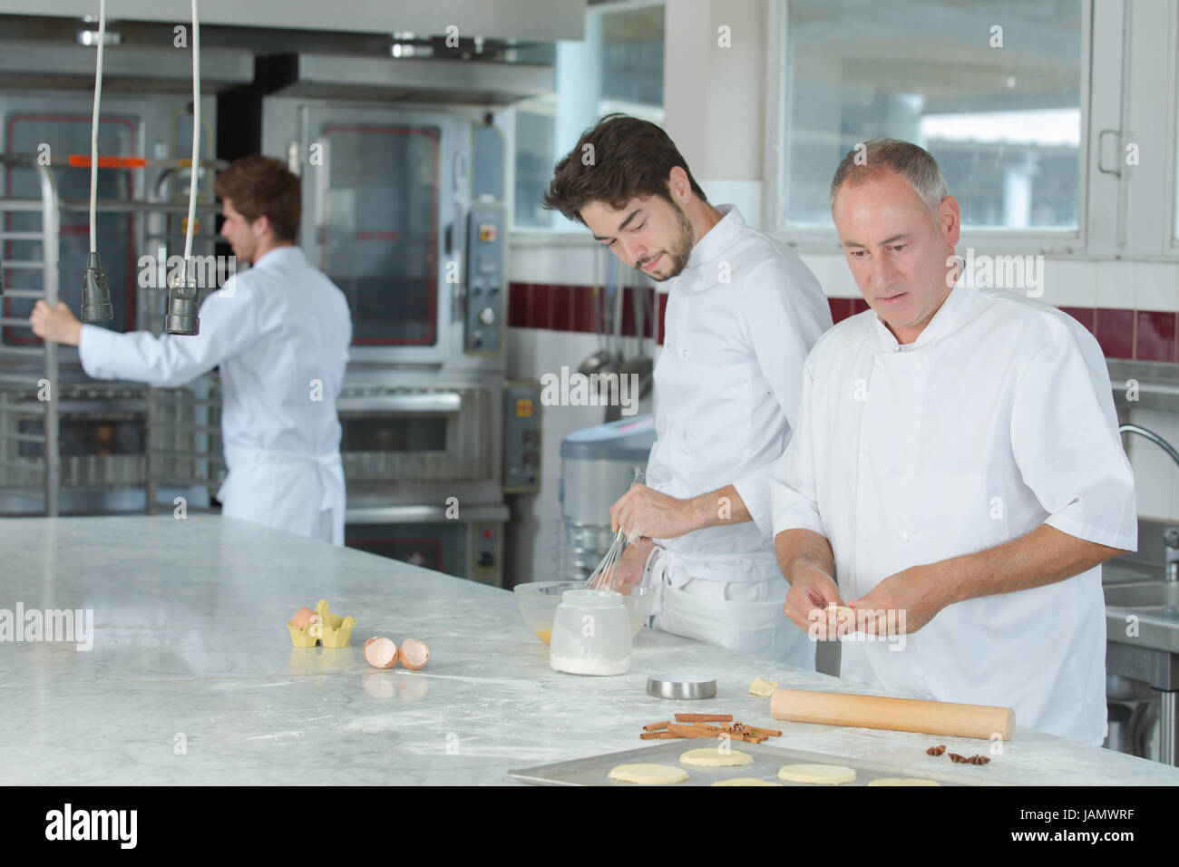 group of students and male chef cook baking in kitchen Stock Photo - Alamy