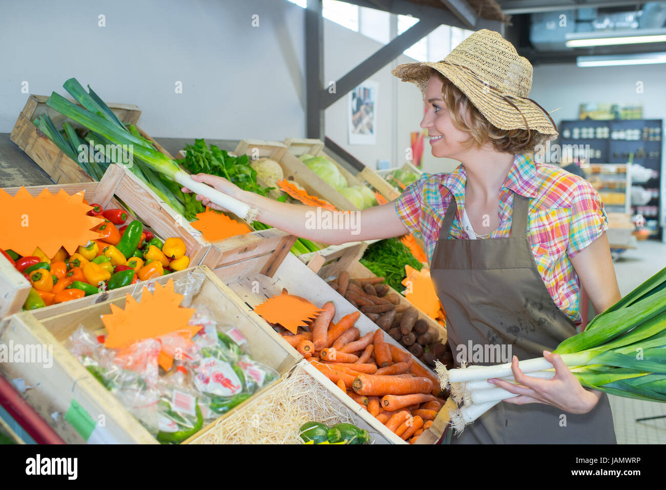 shop assistant working at fruit department in supermarket Stock Photo ...
