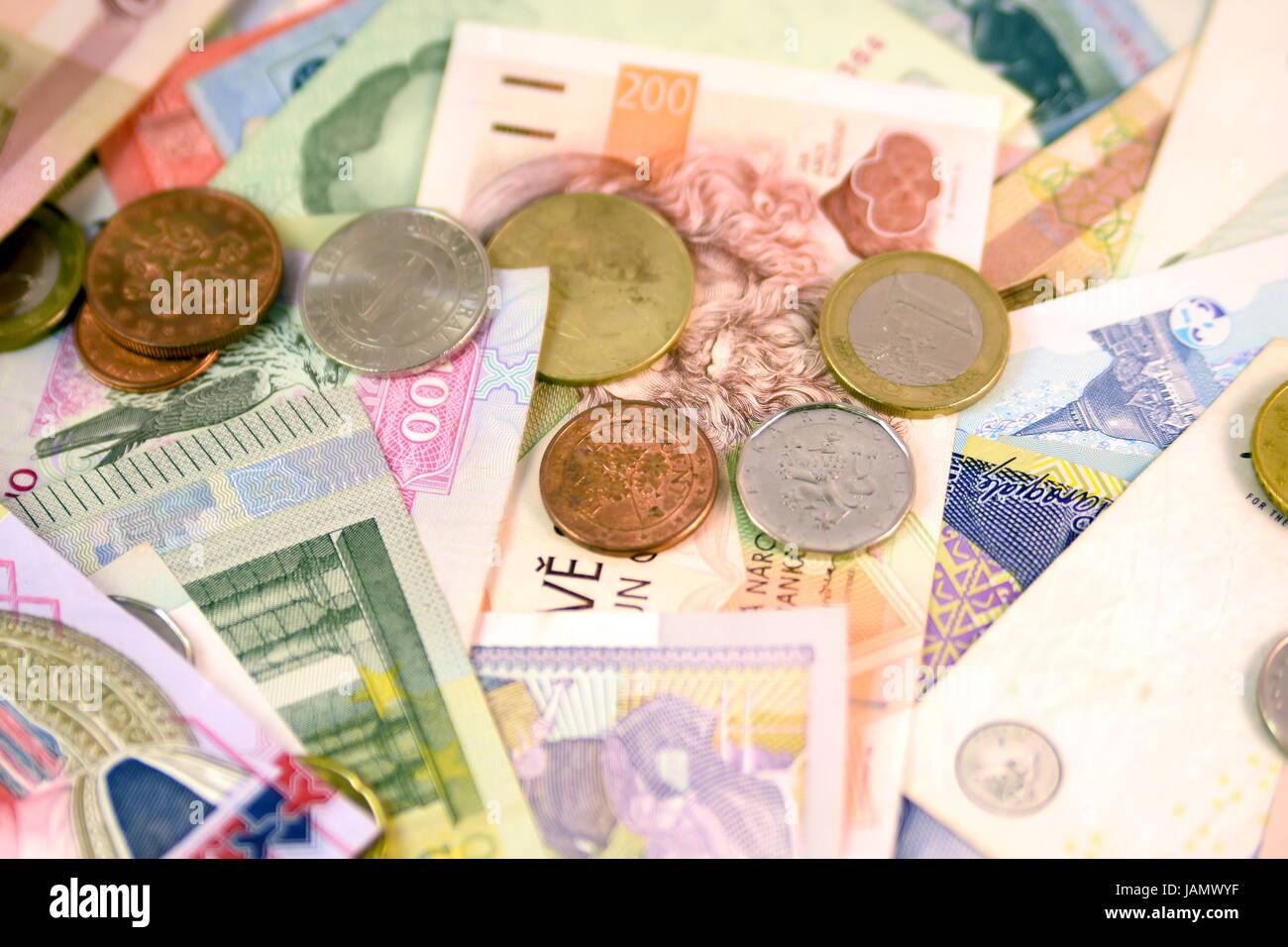 Different currency note and coins from different countries background ...