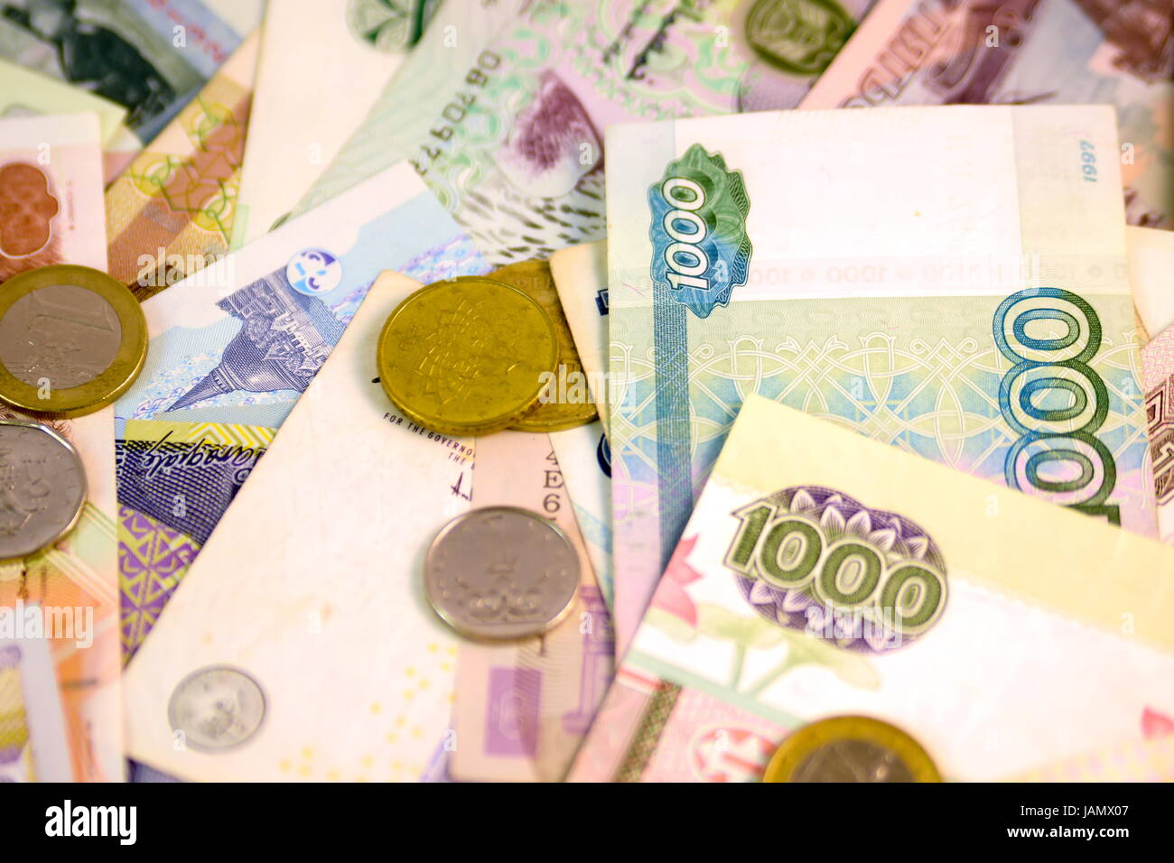 Different currency note and coins from different countries background ...