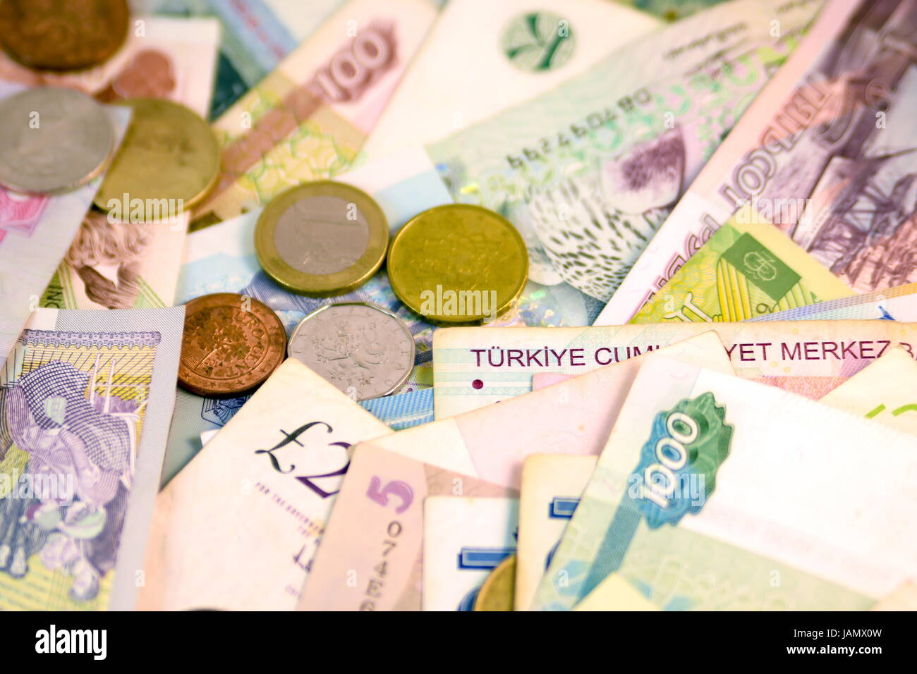 Different currency note and coins from different countries background ...