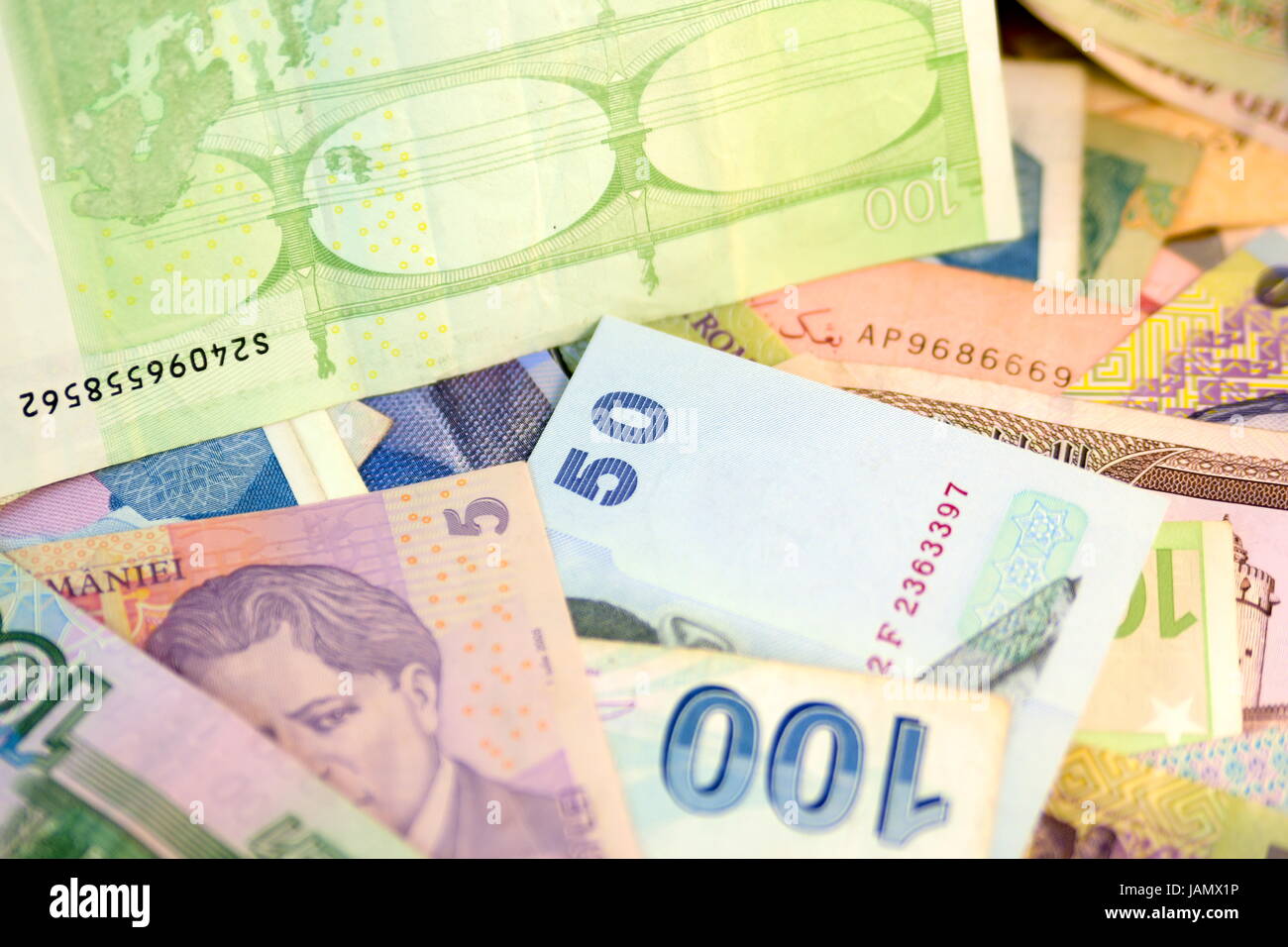Different currency note and coins from different countries background ...