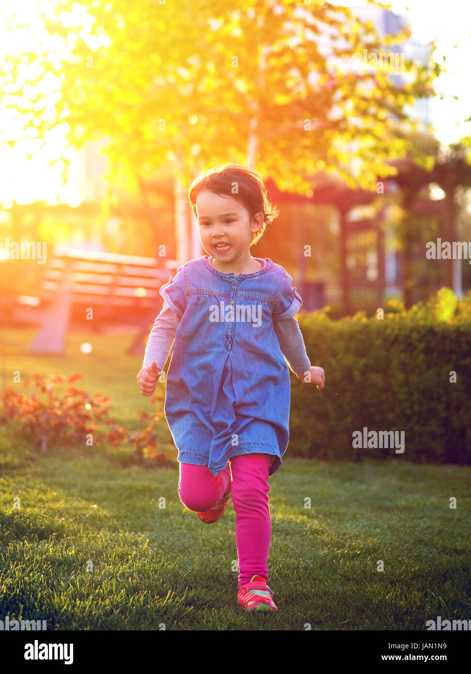 Girl park playing skipping hi-res stock photography and images - Alamy