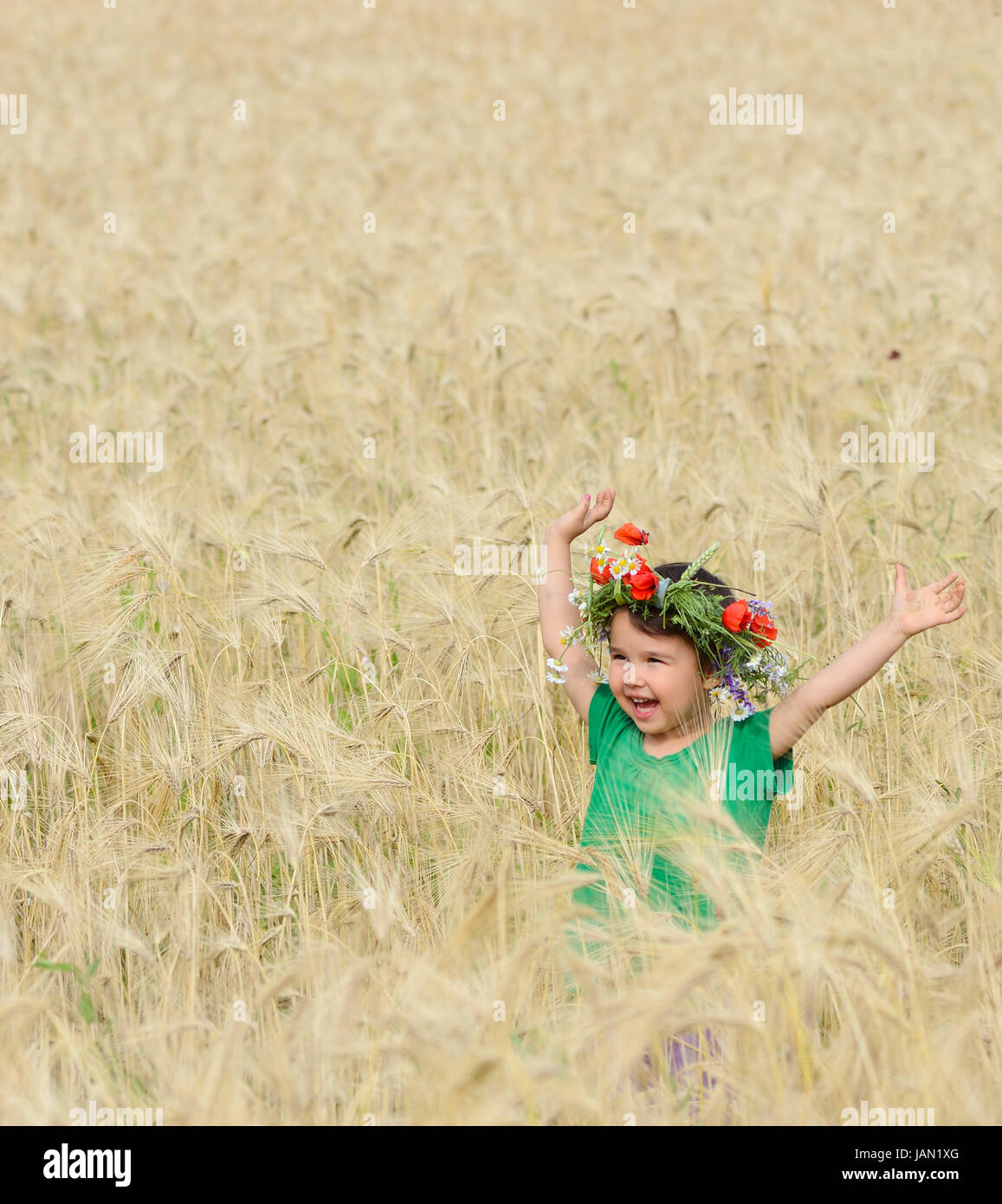 Cute happy baby playing on wheat field Stock Photo - Alamy