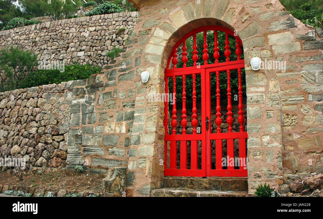 red gate in stone wall Stock Photo - Alamy