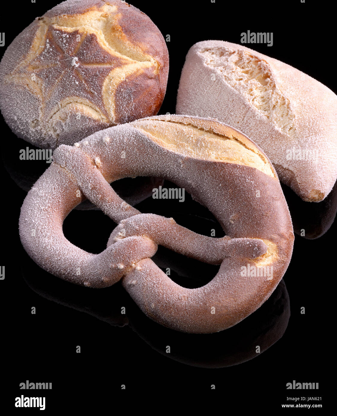 frozen german lye rolls and bread roll in light back Stock Photo - Alamy