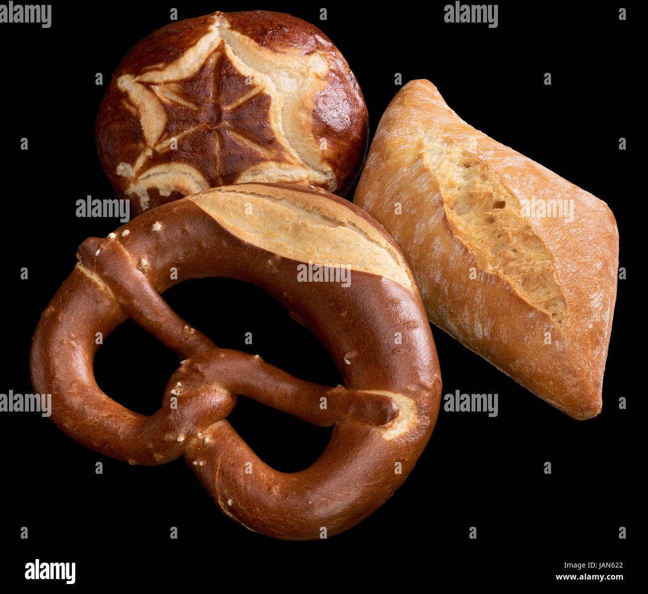 german lye rolls and bread roll in black back Stock Photo - Alamy
