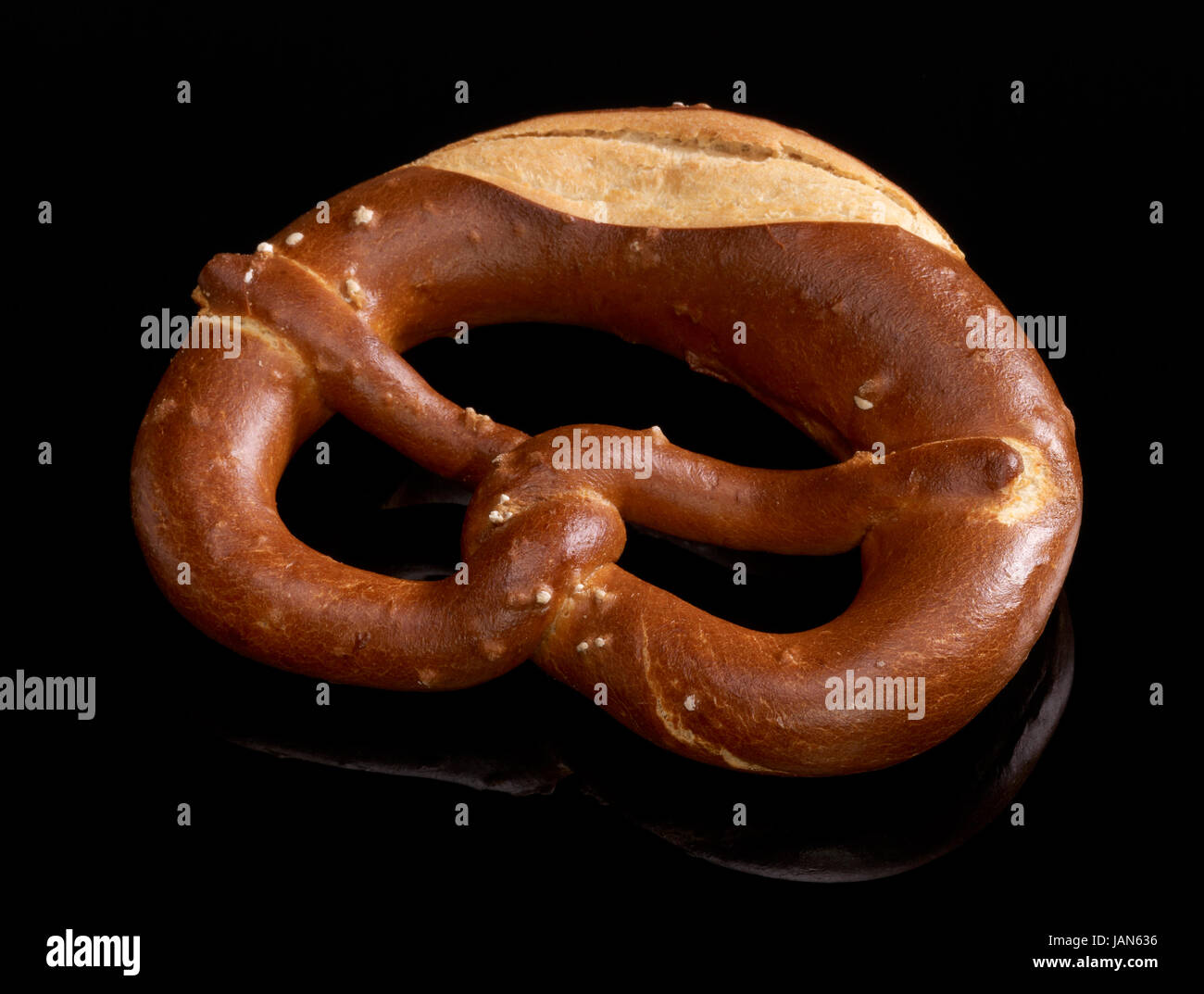a german lye roll named pretzel in black reflective back Stock Photo ...