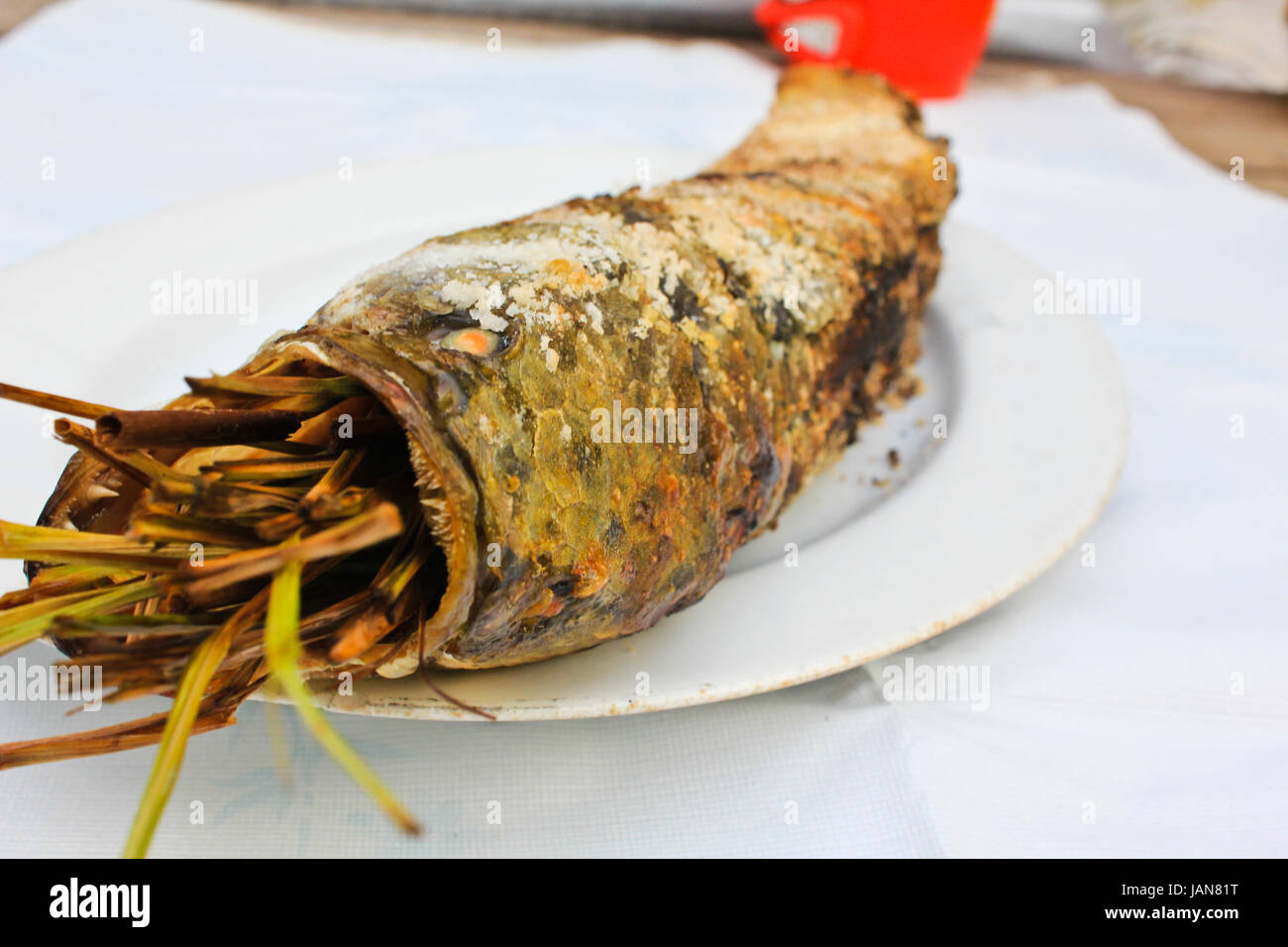 Grilled fish ready for eating Stock Photo - Alamy
