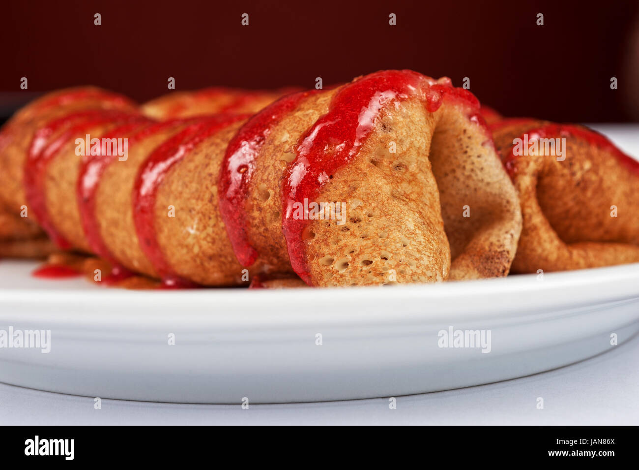 Pancakes with cottage cheese topped with syrup Stock Photo - Alamy