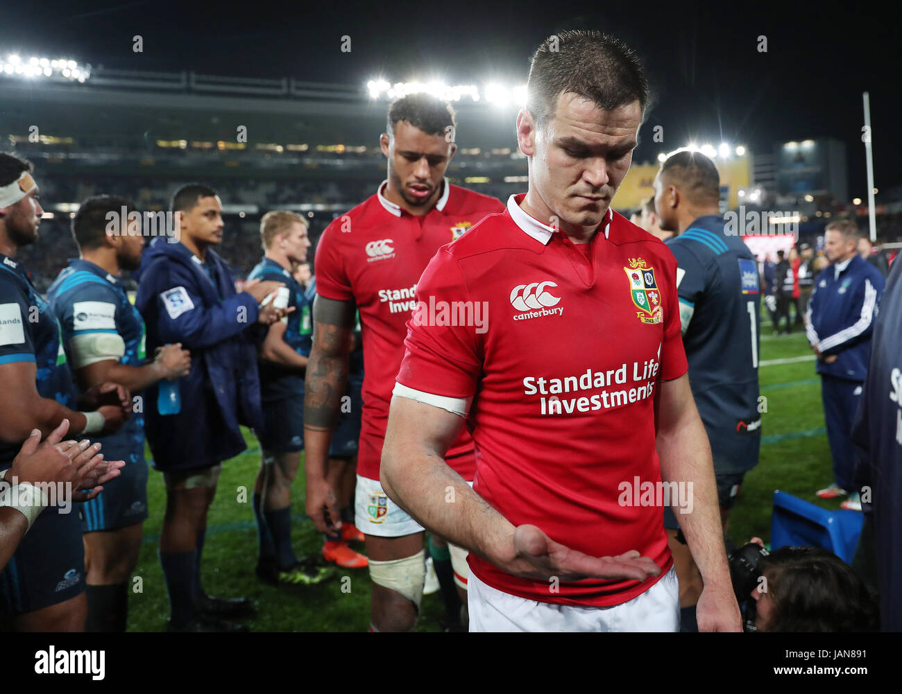British and Irish Lions' Jonathan Sexton leaves the pitch after defeat ...