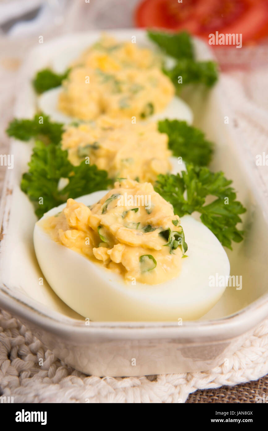 Stuffed eggs with parsley and mayonnaise Stock Photo - Alamy