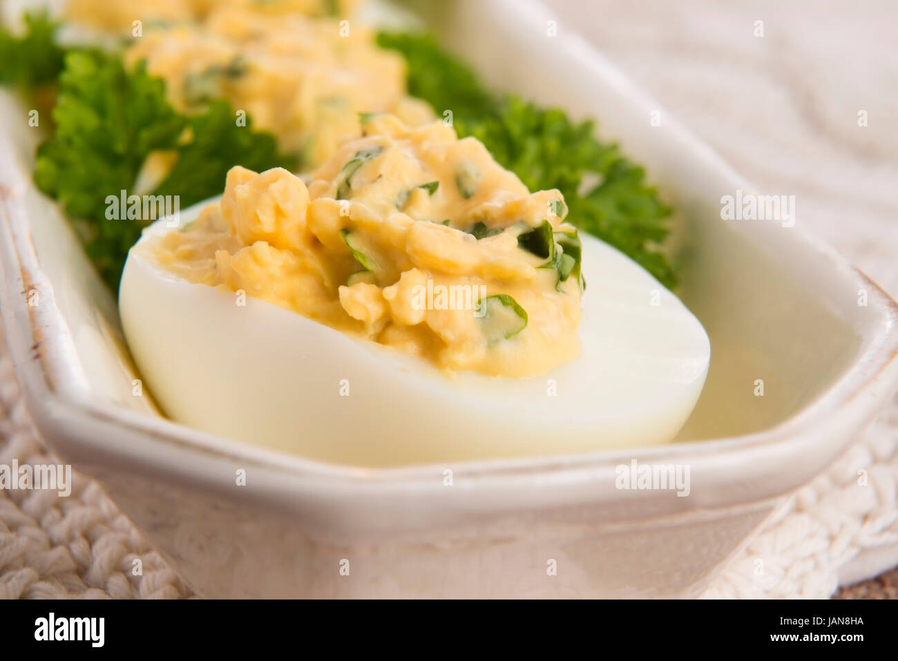 Stuffed eggs with parsley and mayonnaise Stock Photo - Alamy