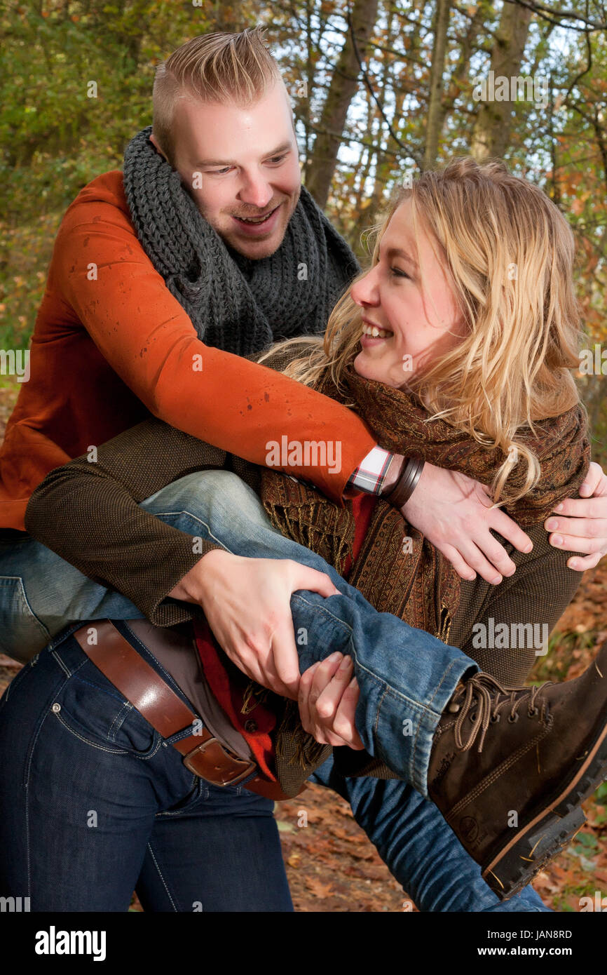 Happy young couple is having a nice time in october Stock Photo - Alamy