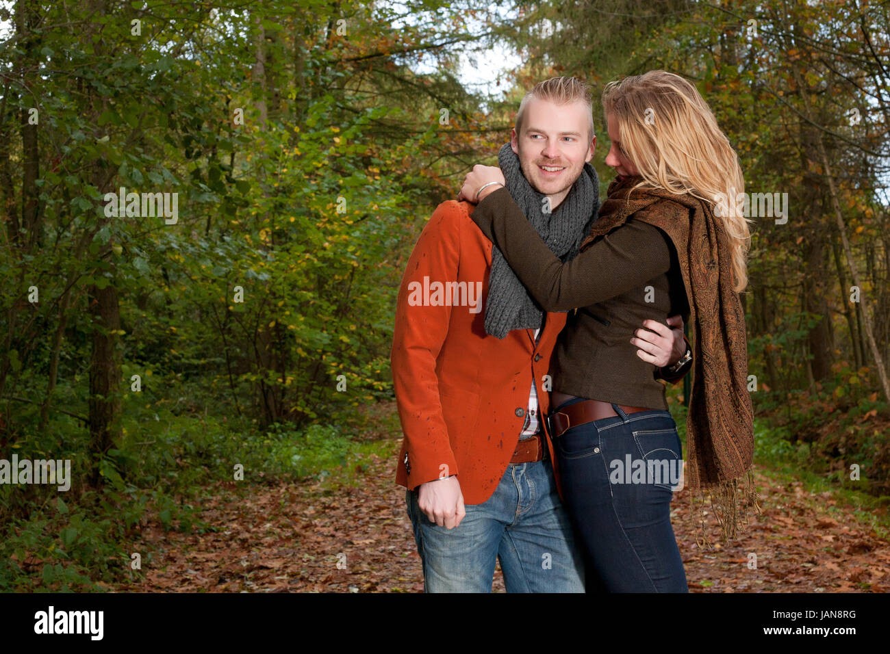 Happy young couple is having a nice time in october Stock Photo - Alamy