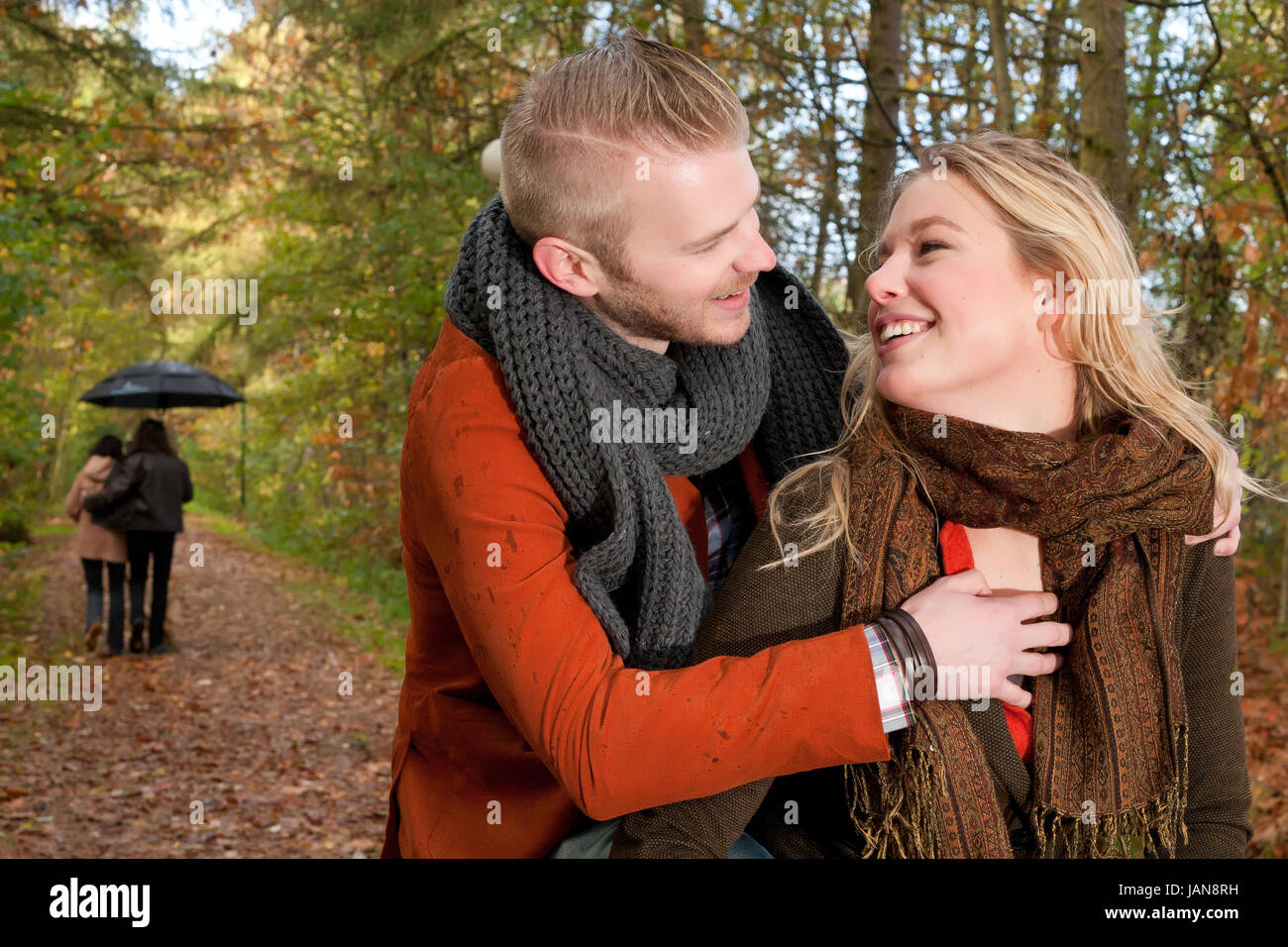 Happy young couple is having a nice time in october Stock Photo - Alamy