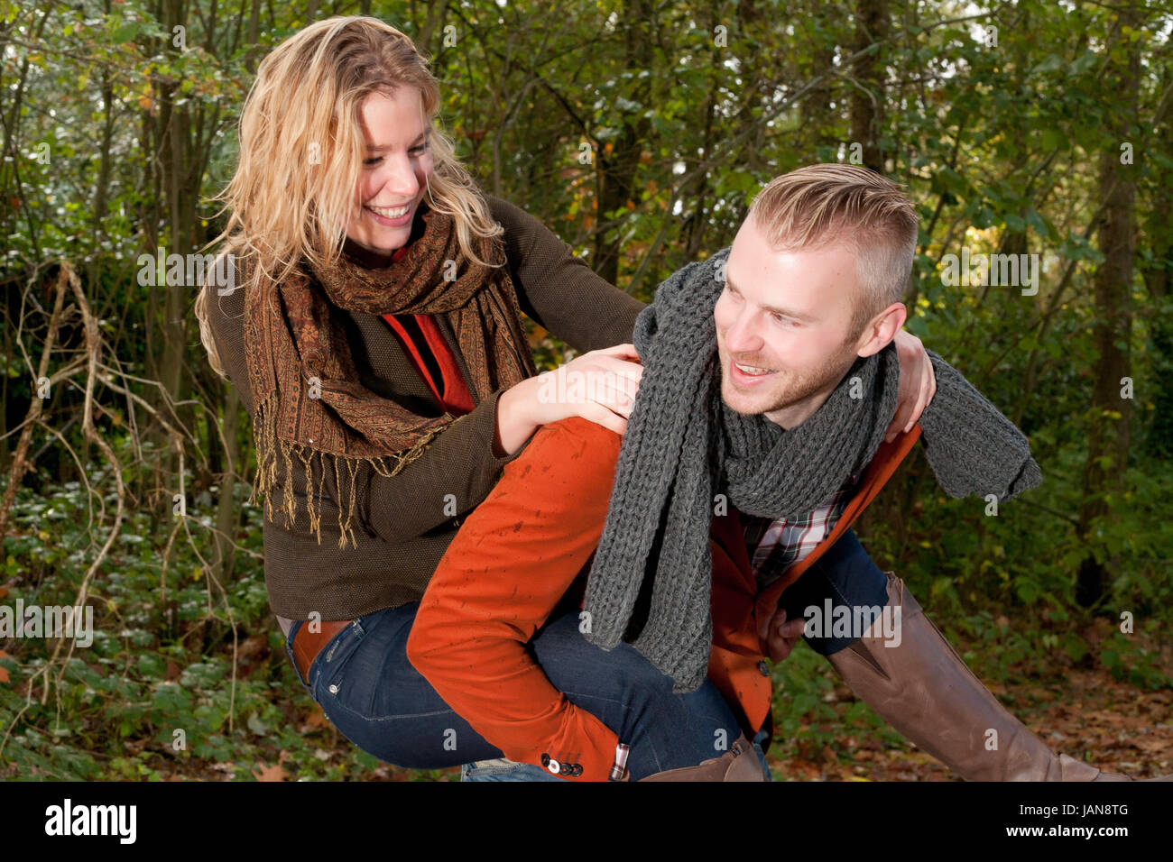 Happy young couple is having a nice time in october Stock Photo - Alamy