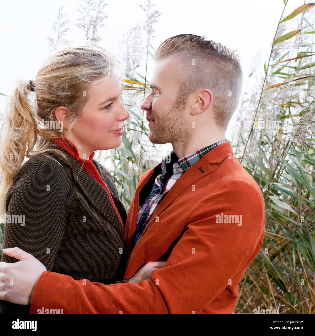 Happy young couple is having a nice time in october Stock Photo - Alamy