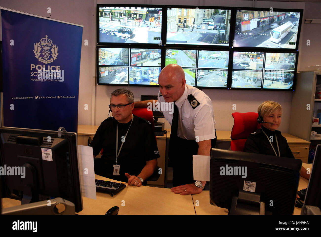 Police Scotland Assistant Chief Constable Bernard Higgins(C) views ...