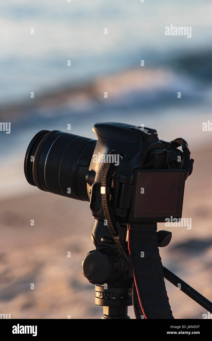 Camera on a tripod to take pictures of the sea Stock Photo - Alamy