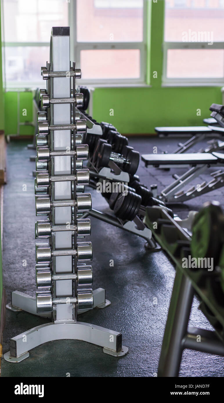 dumbbells in modern sports club. Weight Training Equipment Stock Photo ...