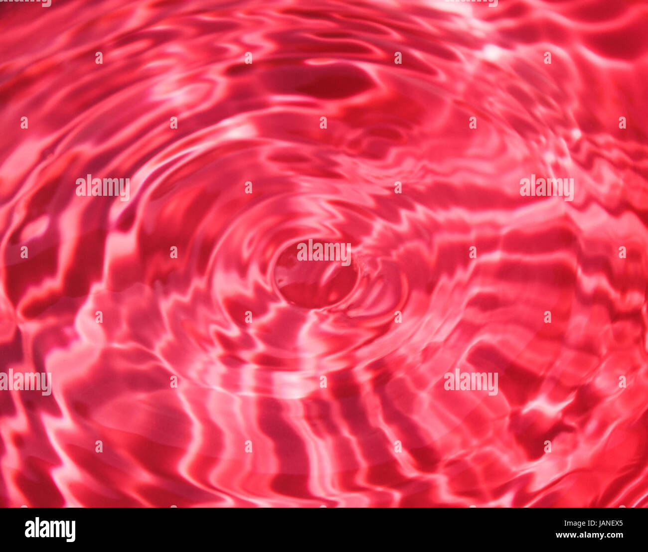 Waves on a surface of red water Stock Photo - Alamy