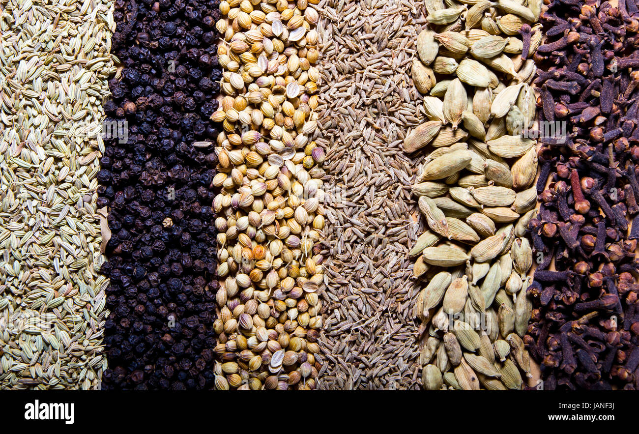 Row of dry spices background Stock Photo - Alamy