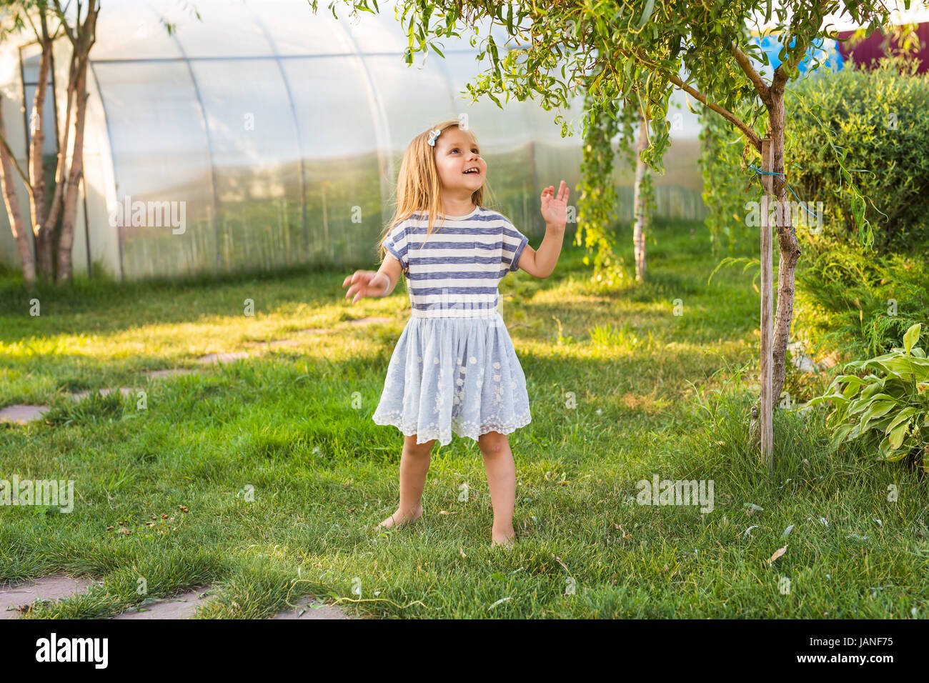 cute little girl in spring or summer day Stock Photo - Alamy