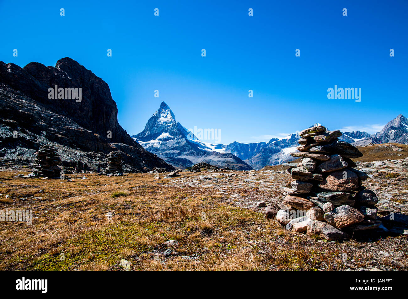 View of Matterhorn and piles of stones Stock Photo - Alamy