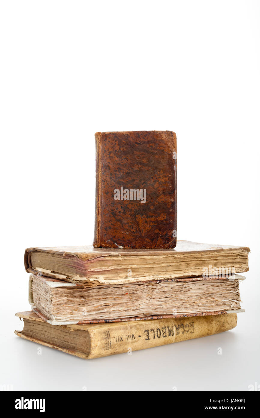 A book standing over three antique books (you can write on the cover of ...