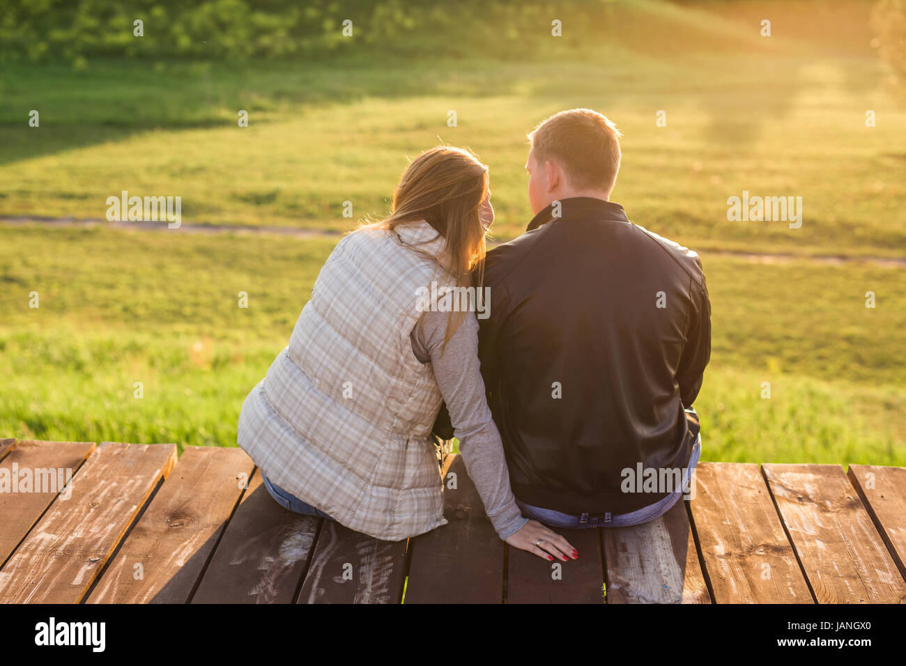couple hugging on a pier in nature back view Stock Photo - Alamy