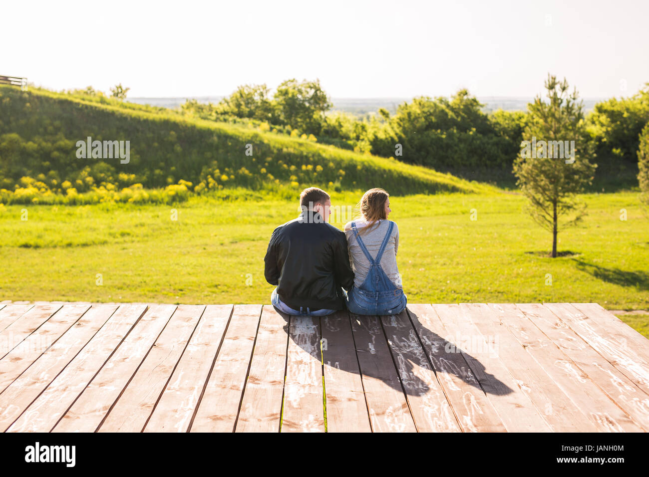Love couple hugging on a pier in nature back view Stock Photo - Alamy