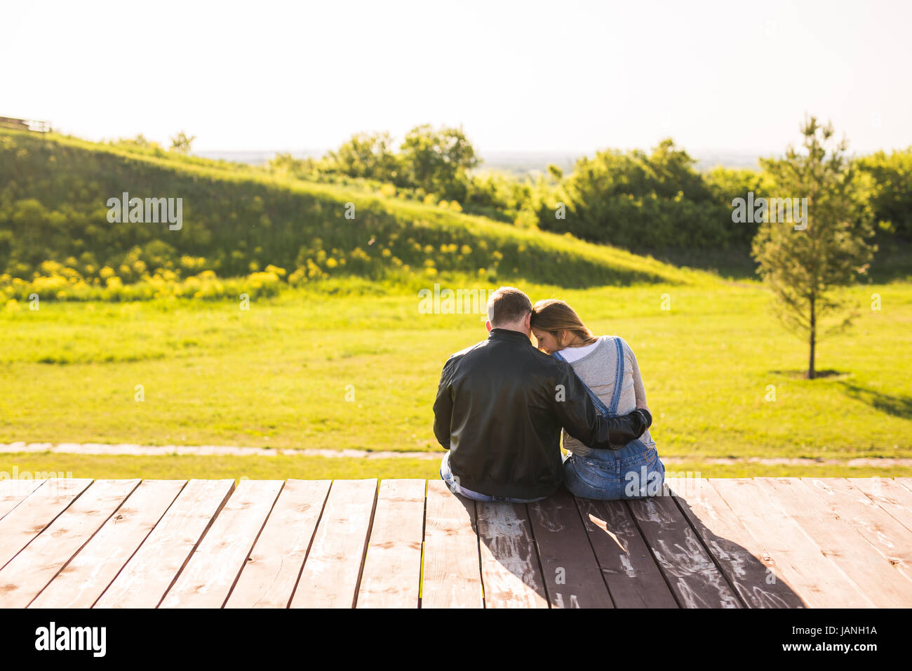 Love couple hugging on a pier in nature back view Stock Photo - Alamy